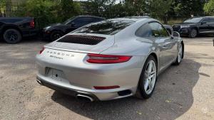 Grey Porsche 911 2019 in Ukmerge, with an engine capacity of 3.00 L and mileage of 28 thousand km for 57990 €, photo  on AUTOMOTO.COM.LV