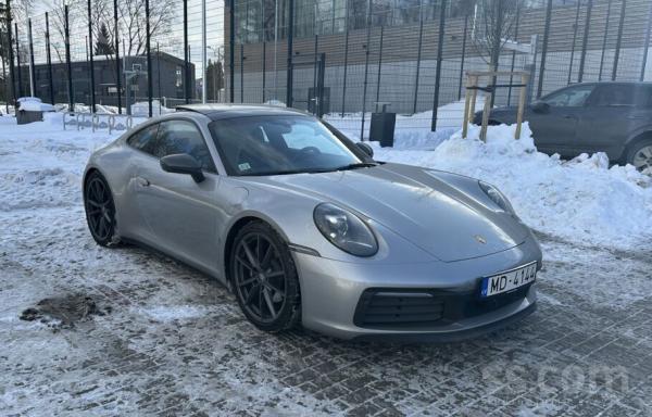 Grey Porsche 911 2024 in Riga, with an engine capacity of 3.00 L and mileage of 15 thousand km for 119000 €, photo 1 on AUTOMOTO.COM.LV