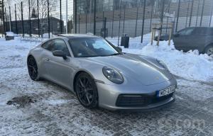 Grey Porsche 911 2024 in Riga, with an engine capacity of 3.00 L and mileage of 15 thousand km for 119000 €, photo 1 on AUTOMOTO.COM.LV