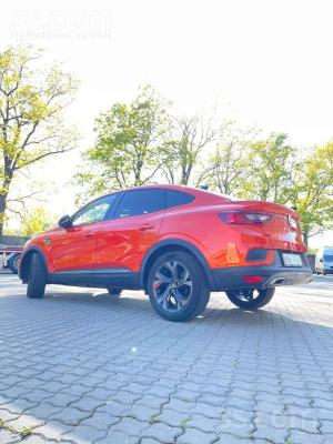 Orange Renault Arkana 2021 in Riga, with an engine capacity of 1.30 L and mileage of 77 thousand km for 15400 €, photo 5 on AUTOMOTO.COM.LV