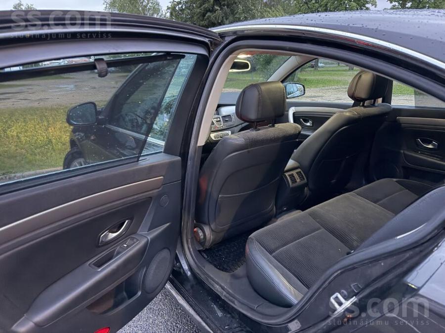 Black Renault Laguna 2007 in Riga, with an engine capacity of 2.00 L and mileage of 263 thousand km for 2000 €, photo 11 on AUTOMOTO.COM.LV