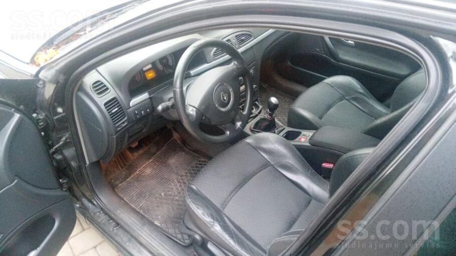 Black Renault Laguna 2006 in Riga, with an engine capacity of 2.20 L and mileage of 288 thousand km for 1650 €, photo 11 on AUTOMOTO.COM.LV