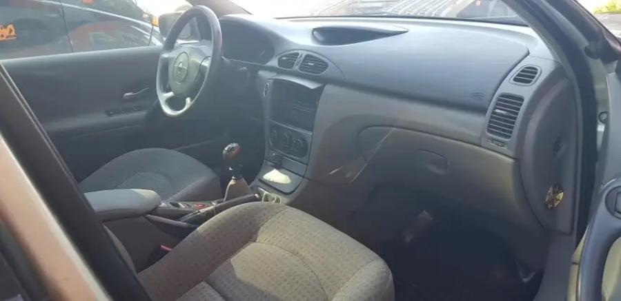 Grey Renault Laguna 2003 in Valmiera, with an engine capacity of 1.90 L and mileage of 297 thousand km for 1300 €, photo 13 on AUTOMOTO.COM.LV