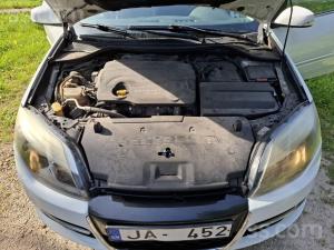 White Renault Laguna 2012 in Riga, with an engine capacity of 2.00 L and mileage of 318 thousand km for 3000 €, photo 7 on AUTOMOTO.COM.LV