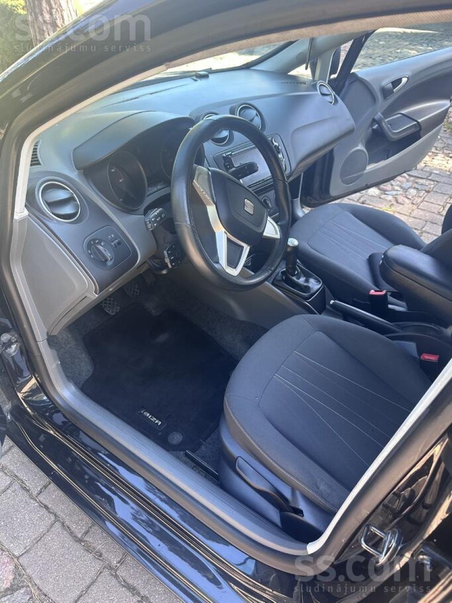 Black SEAT Ibiza 2012 in Riga, with an engine capacity of 1.20 L and mileage of 205 thousand km for 2900 €, photo 8 on AUTOMOTO.COM.LV
