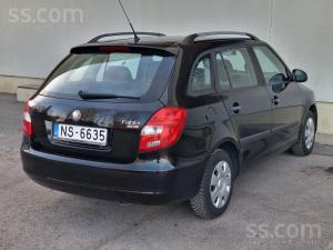 Black Skoda Fabia 2010 in Ogre, with an engine capacity of 1.40 L and mileage of 210 thousand km for 3150 €, photo 8 on AUTOMOTO.COM.LV