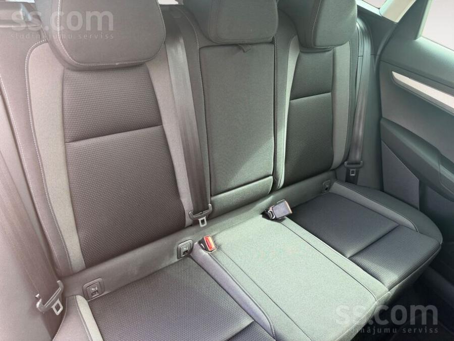 Black Skoda Karoq 2023 in Riga, with an engine capacity of 2.00 L and mileage of 100 thousand km for 22000 €, photo 8 on AUTOMOTO.COM.LV