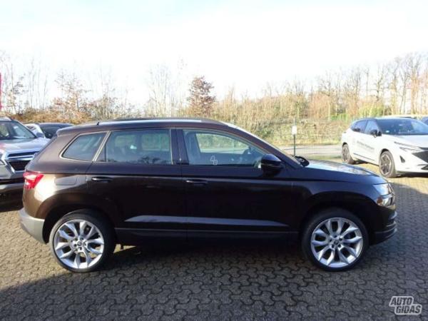 Brown Skoda Karoq 2020 in Kaunas, with an engine capacity of 1.50 L and mileage of 52 thousand km for 22349 €, photo 4 on AUTOMOTO.COM.LV