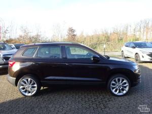 Brown Skoda Karoq 2020 in Kaunas, with an engine capacity of 1.50 L and mileage of 52 thousand km for 22349 €, photo 4 on AUTOMOTO.COM.LV