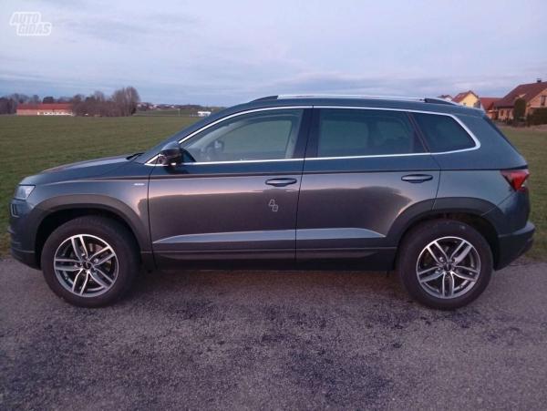 Grey Skoda Karoq 2022 in Kaunas, with an engine capacity of 1.50 L and mileage of 54 thousand km for 25954 €, photo 1 on AUTOMOTO.COM.LV