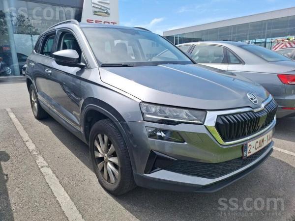 Grey Skoda Karoq 2022 in Ogre, with an engine capacity of 2.00 L and mileage of 142 thousand km for 18470 €, photo 1 on AUTOMOTO.COM.LV