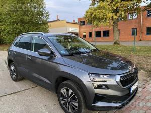 Grey Skoda Karoq 2023 in Riga, with an engine capacity of 1.50 L and mileage of 74 thousand km for 22000 €, photo  on AUTOMOTO.COM.LV