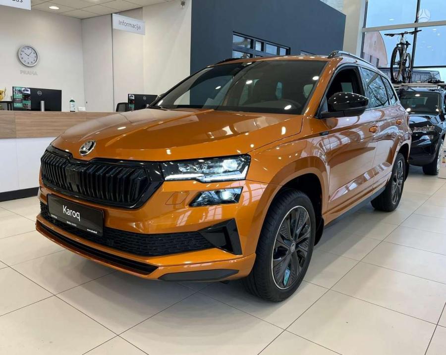 Orange Skoda Karoq 2026 in Kaunas, with an engine capacity of 1.50 L and mileage of 0 thousand km for 34690 €, photo 1 on AUTOMOTO.COM.LV