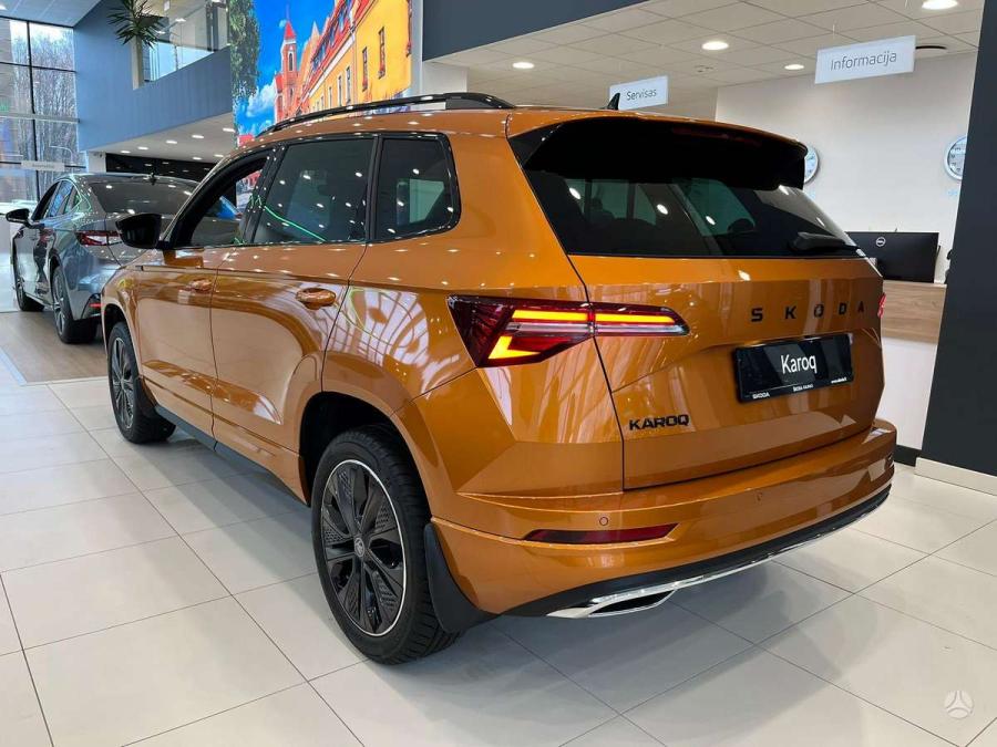 Orange Skoda Karoq 2026 in Kaunas, with an engine capacity of 1.50 L and mileage of 0 thousand km for 34690 €, photo 8 on AUTOMOTO.COM.LV