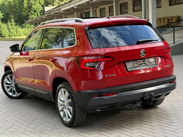 Red Skoda Karoq 2018 in Prienai, with an engine capacity of 1.60 L and mileage of 245 thousand km for 13950 €, photo 7 on AUTOMOTO.COM.LV