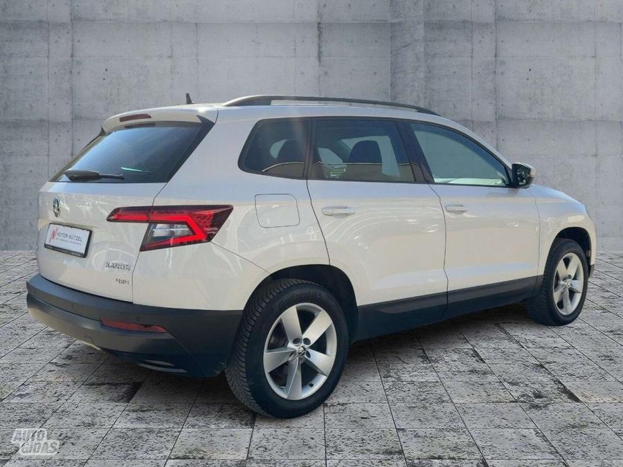 White Skoda Karoq 2019 in Kaunas, with an engine capacity of 2.00 L and mileage of 87 thousand km for 22694 €, photo 6 on AUTOMOTO.COM.LV