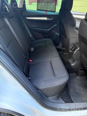 White Skoda Karoq 2019 in Riga, with an engine capacity of 1.60 L and mileage of 188 thousand km for 14500 €, photo 15 on AUTOMOTO.COM.LV