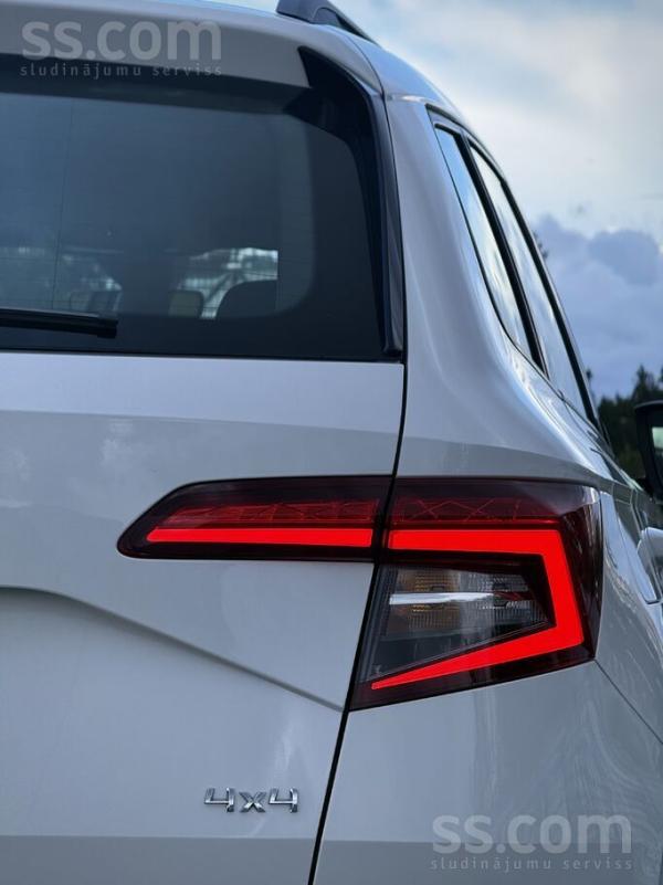 White Skoda Karoq 2021 in Riga, with an engine capacity of 2.00 L and mileage of 112 thousand km for 19990 €, photo 6 on AUTOMOTO.COM.LV