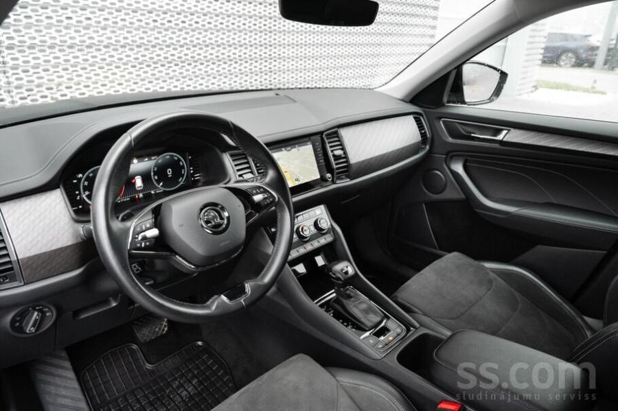 Black Skoda Kodiaq 2023 in Riga, with an engine capacity of 1.50 L and mileage of 125 thousand km for 28650 €, photo 12 on AUTOMOTO.COM.LV