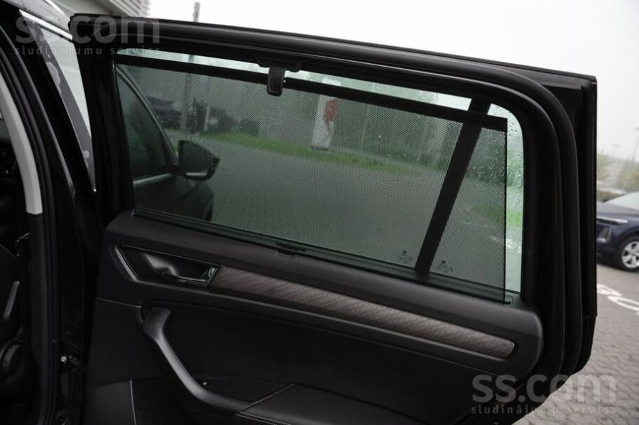 Black Skoda Kodiaq 2023 in Riga, with an engine capacity of 1.50 L and mileage of 125 thousand km for 28650 €, photo 30 on AUTOMOTO.COM.LV