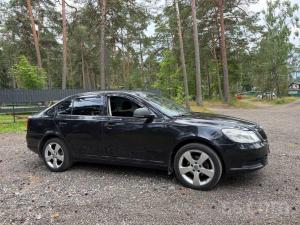 Black Skoda Octavia 2010 in Riga, with an engine capacity of 1.40 L and mileage of 214 thousand km for 3000 €, photo 3 on AUTOMOTO.COM.LV
