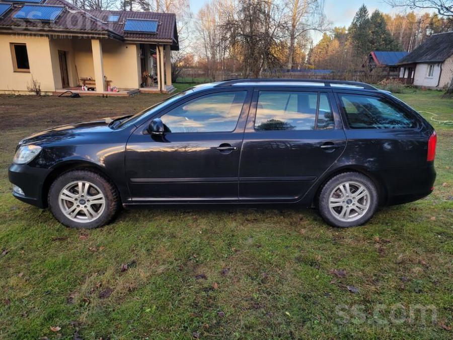 Black Skoda Octavia 2009 in Riga, with an engine capacity of 2.00 L and mileage of 310 thousand km for 1549 €, photo 8 on AUTOMOTO.COM.LV