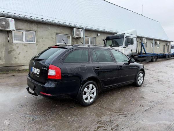 Black Skoda Octavia 2011 in Kaunas, with an engine capacity of 1.80 L and mileage of 231 thousand km for 1750 €, photo 5 on AUTOMOTO.COM.LV