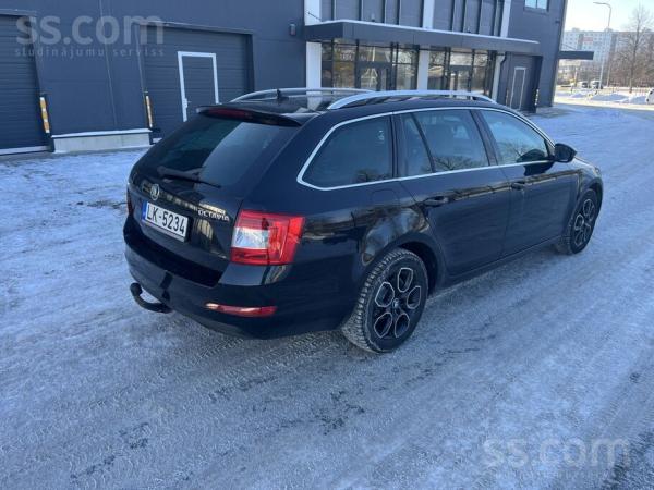 Black Skoda Octavia 2014 in Riga, with an engine capacity of 2.00 L and mileage of 304 thousand km for 7300 €, photo 4 on AUTOMOTO.COM.LV