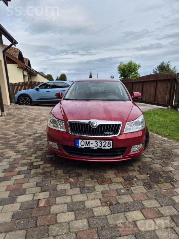 Red Skoda Octavia 2011 in Riga, with an engine capacity of 1.40 L and mileage of 208 thousand km for 3400 €, photo 2 on AUTOMOTO.COM.LV