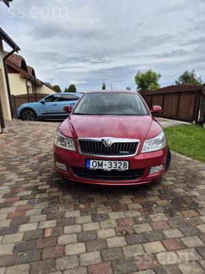 Red Skoda Octavia 2011 in Riga, with an engine capacity of 1.40 L and mileage of 208 thousand km for 1200 €, photo 3 on AUTOMOTO.COM.LV