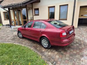 Red Skoda Octavia 2011 in Riga, with an engine capacity of 1.40 L and mileage of 208 thousand km for 1200 €, photo 4 on AUTOMOTO.COM.LV