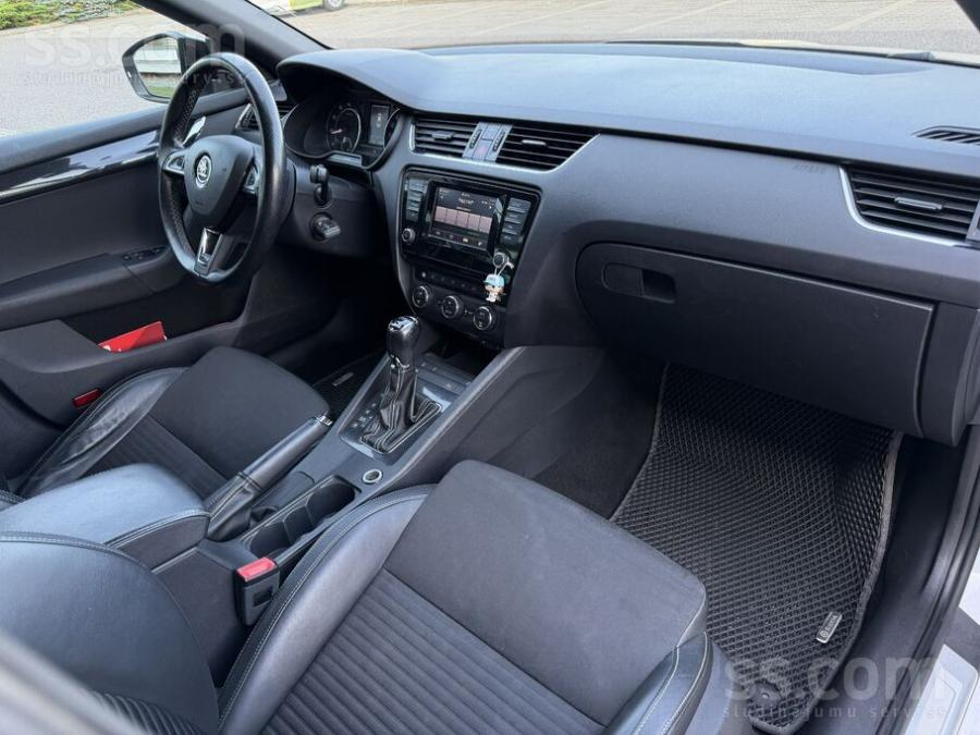 White Skoda Octavia 2014 in Riga, with an engine capacity of 2.00 L and mileage of 195 thousand km for 8900 €, photo 13 on AUTOMOTO.COM.LV