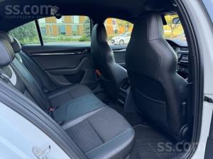 White Skoda Octavia 2014 in Riga, with an engine capacity of 2.00 L and mileage of 195 thousand km for 8900 €, photo 14 on AUTOMOTO.COM.LV