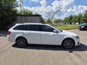 White Skoda Octavia 2014 in Riga, with an engine capacity of 2.00 L and mileage of 231 thousand km for 9990 €, photo 6 on AUTOMOTO.COM.LV