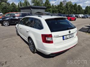 White Skoda Octavia 2014 in Riga, with an engine capacity of 2.00 L and mileage of 231 thousand km for 9990 €, photo 9 on AUTOMOTO.COM.LV