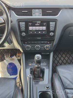 White Skoda Octavia 2014 in Riga, with an engine capacity of 2.00 L and mileage of 231 thousand km for 9990 €, photo 12 on AUTOMOTO.COM.LV