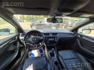 White Skoda Octavia 2014 in Riga, with an engine capacity of 2.00 L and mileage of 231 thousand km for 9990 €, photo 19 on AUTOMOTO.COM.LV