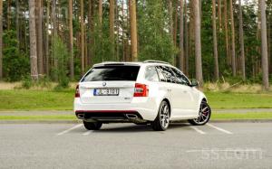 White Skoda Octavia 2014 in Riga, with an engine capacity of 2.00 L and mileage of 231 thousand km for 9190 €, photo 6 on AUTOMOTO.COM.LV