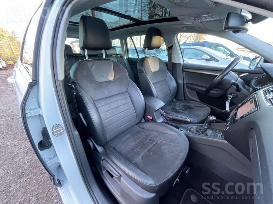 White Skoda Octavia 2015 in Riga, with an engine capacity of 2.00 L and mileage of 257 thousand km for 9990 €, photo 18 on AUTOMOTO.COM.LV