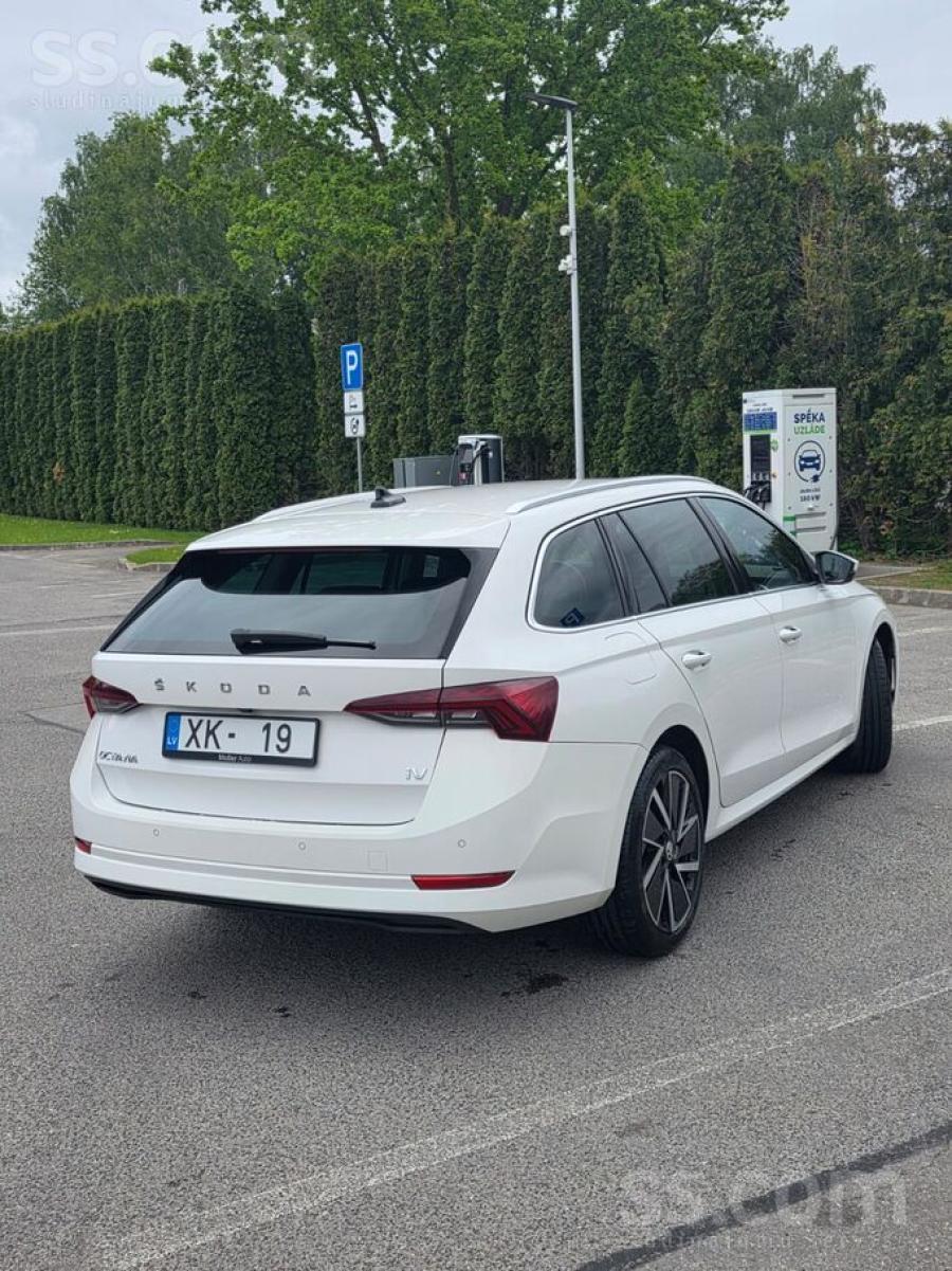 White Skoda Octavia 2021 in Riga, with an engine capacity of 1.40 L and mileage of 131 thousand km for 18900 €, photo 4 on AUTOMOTO.COM.LV