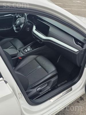 White Skoda Octavia 2021 in Riga, with an engine capacity of 1.40 L and mileage of 131 thousand km for 18900 €, photo 11 on AUTOMOTO.COM.LV