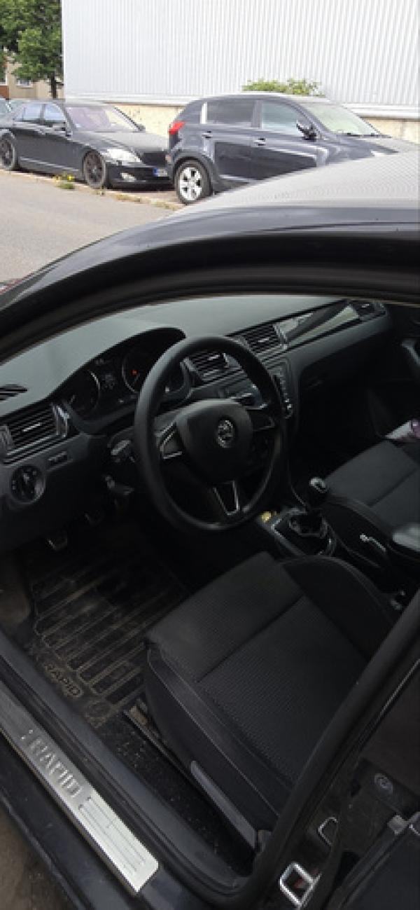Black Skoda Rapid 2014 in Tallinn, with an engine capacity of 1.20 L and mileage of 336 thousand km for 2439 €, photo 4 on AUTOMOTO.COM.LV