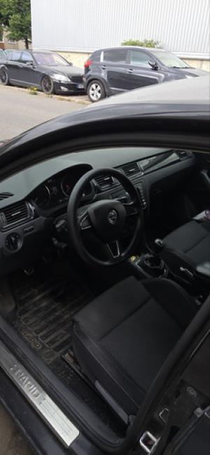 Black Skoda Rapid 2014 in Tallinn, with an engine capacity of 1.20 L and mileage of 336 thousand km for 2439 €, photo 5 on AUTOMOTO.COM.LV