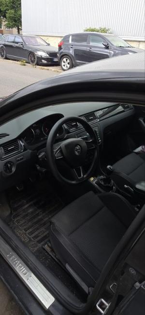 Black Skoda Rapid 2014 in Tallinn, with an engine capacity of 1.20 L and mileage of 336 thousand km for 2439 €, photo 12 on AUTOMOTO.COM.LV