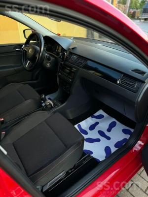 Red Skoda Rapid 2014 in Balvi, with an engine capacity of 1.60 L and mileage of 318 thousand km for 2750 €, photo 16 on AUTOMOTO.COM.LV