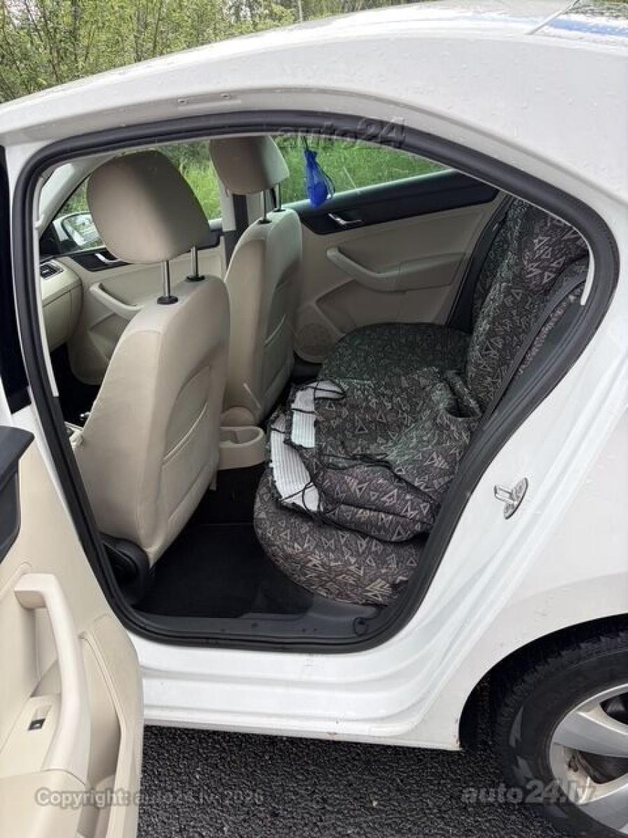 White Skoda Rapid 2013 in Tallinn, with an engine capacity of 1.20 L and mileage of 192 thousand km for 3899 €, photo 8 on AUTOMOTO.COM.LV