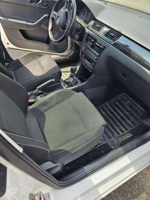 White Skoda Rapid 2014 in Utena, with an engine capacity of 1.60 L and mileage of 238 thousand km for 2799 €, photo 14 on AUTOMOTO.COM.LV