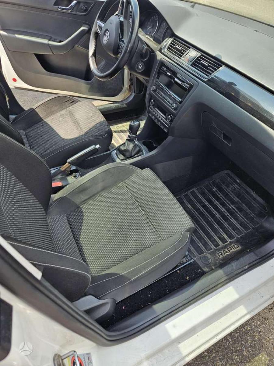 White Skoda Rapid 2014 in Utena, with an engine capacity of 1.60 L and mileage of 238 thousand km for 2799 €, photo 14 on AUTOMOTO.COM.LV
