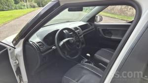 White Skoda Roomster 2012 in Riga, with an engine capacity of 1.20 L and mileage of 443 thousand km for 1600 €, photo 11 on AUTOMOTO.COM.LV