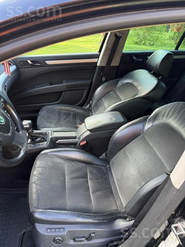 Black Skoda SuperB 2011 in Riga, with an engine capacity of 2.00 L and mileage of 379 thousand km for 4200 €, photo 6 on AUTOMOTO.COM.LV